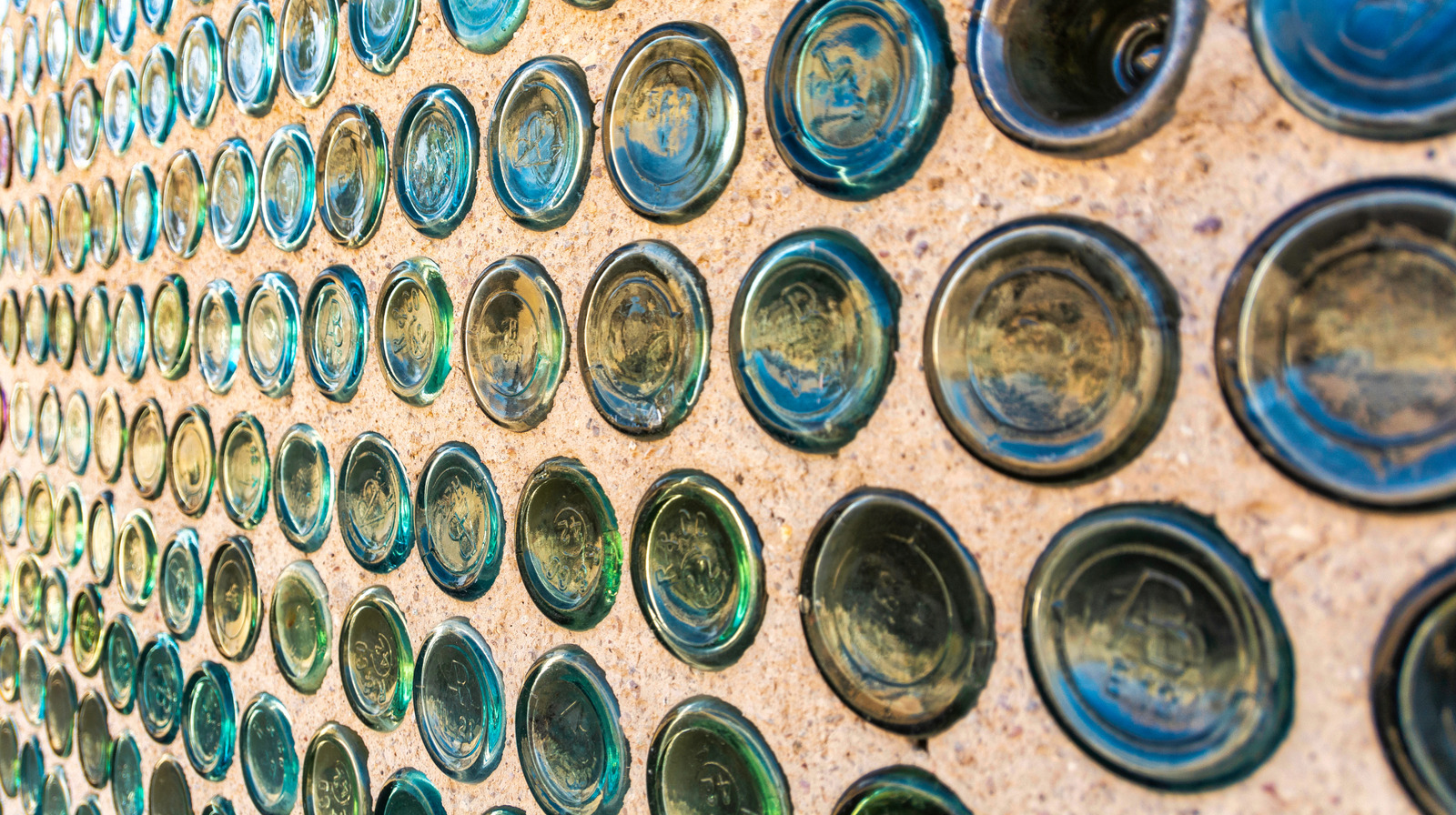 How To Reuse Old Glass Bottles And Jars To DIY A Unique Garden Cob Wall