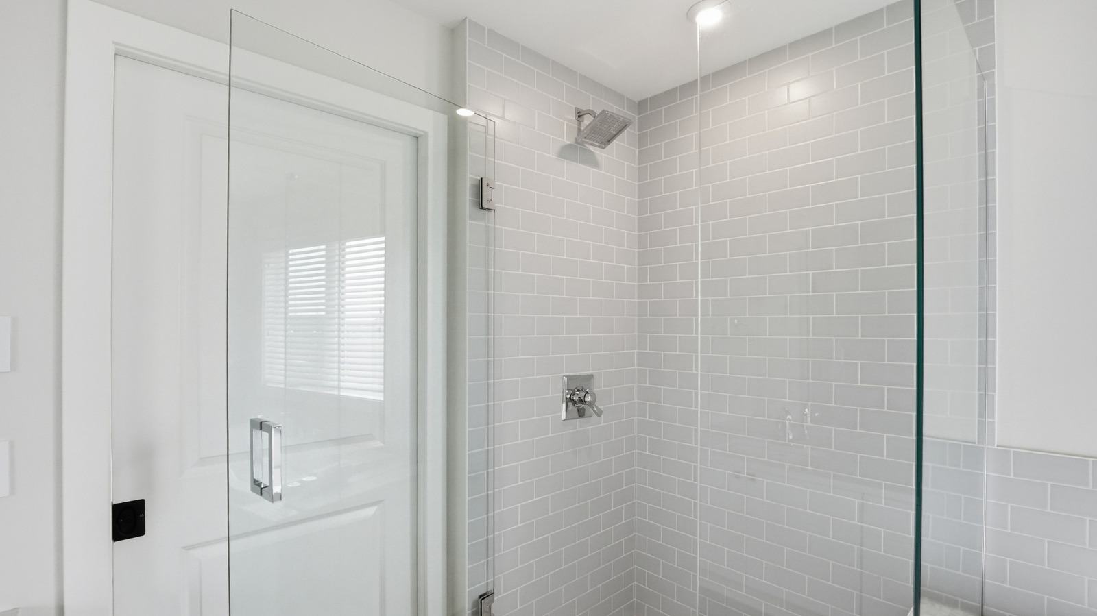 No More Shower Clutter: Here's An Easy Way To Add Storage To Glass Doors