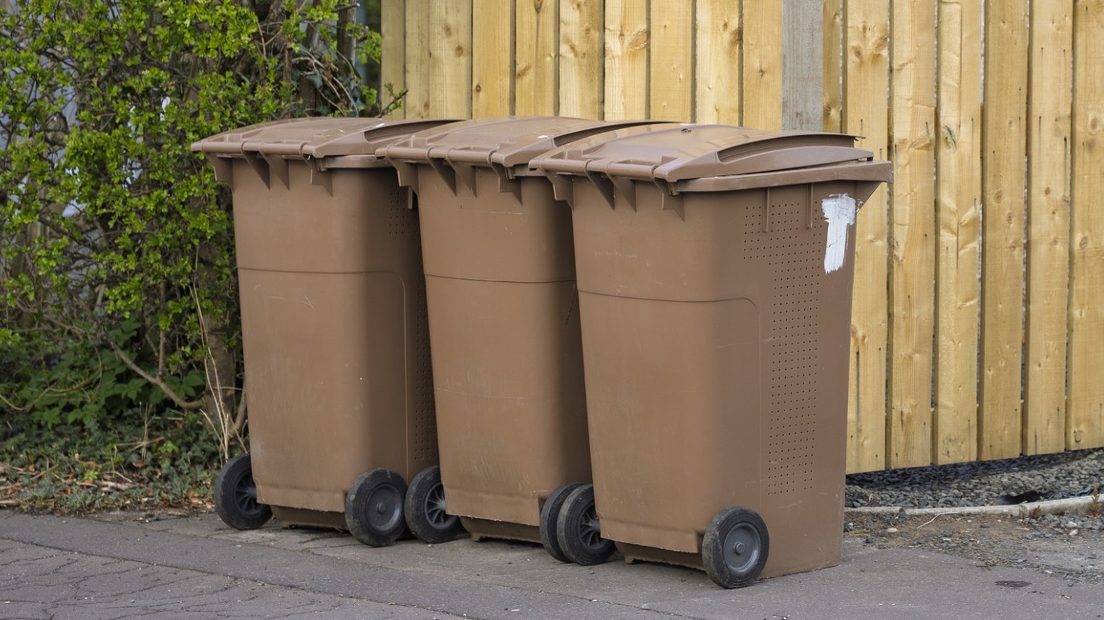 Say Goodbye To The Eyesore Of Outdoor Trash Cans With A DIY Storage Shed