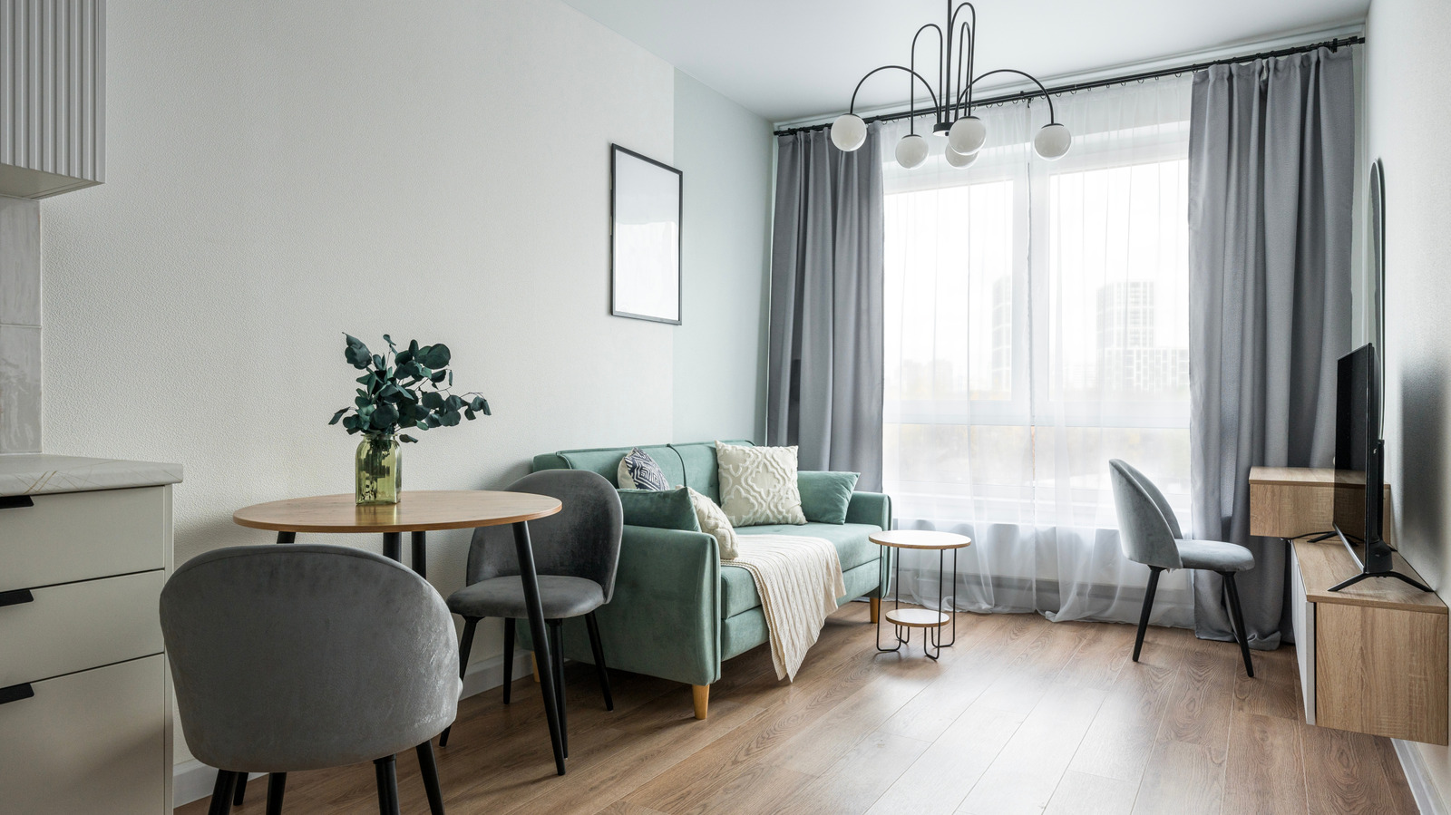 The Designer Trick That Makes A Narrow Living Room Feel Way Bigger