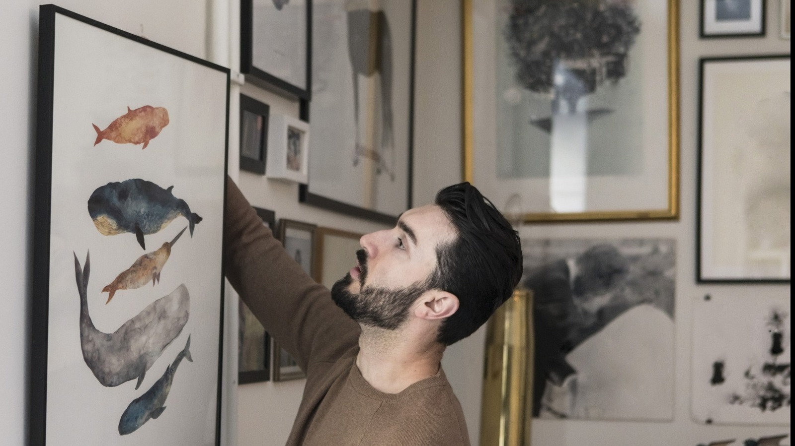 The Tape Hack That Makes Hanging Pictures With Two Nails A Breeze